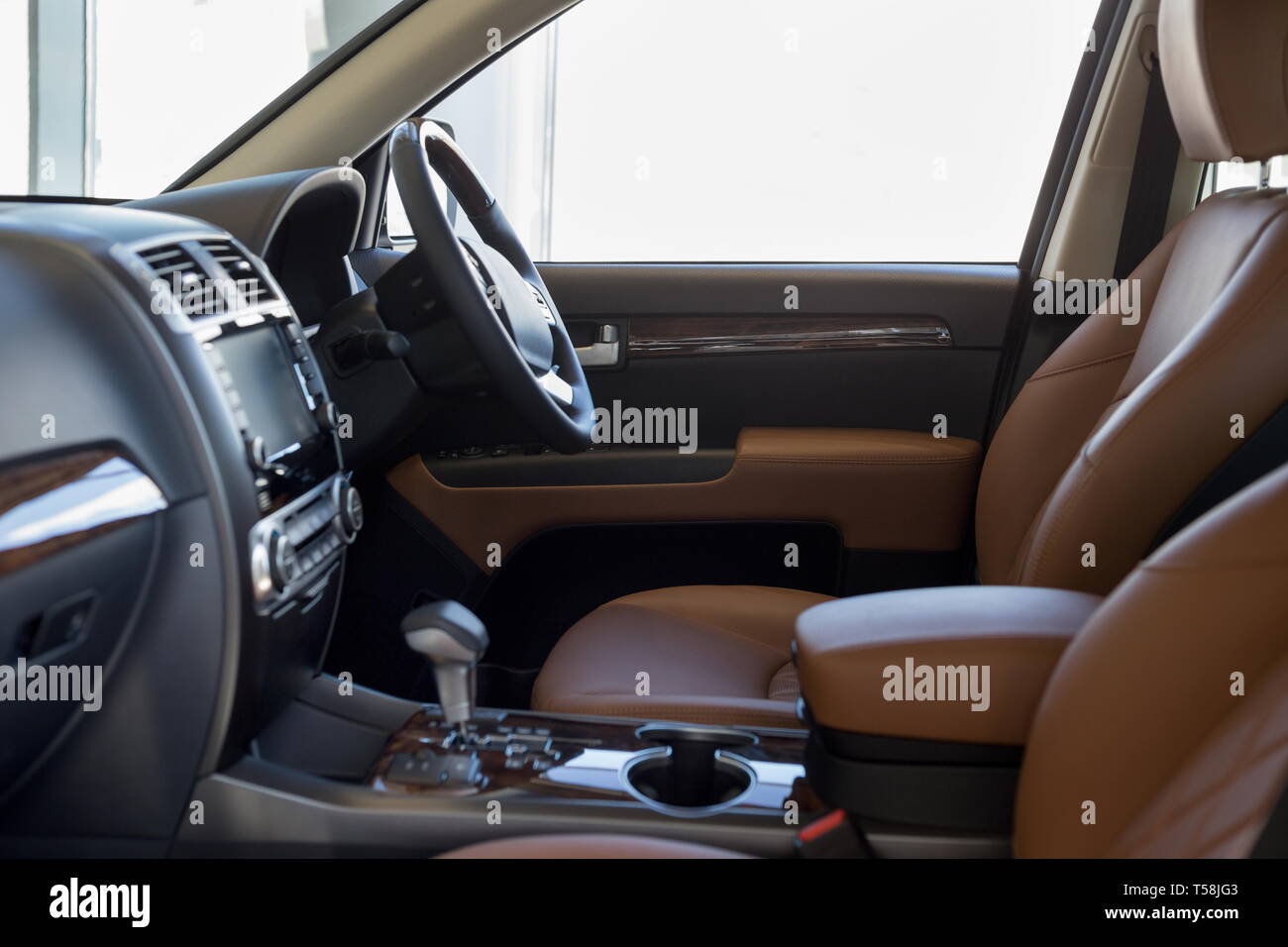 Interior of prestigious new car with leather car interior. Themed blur ...