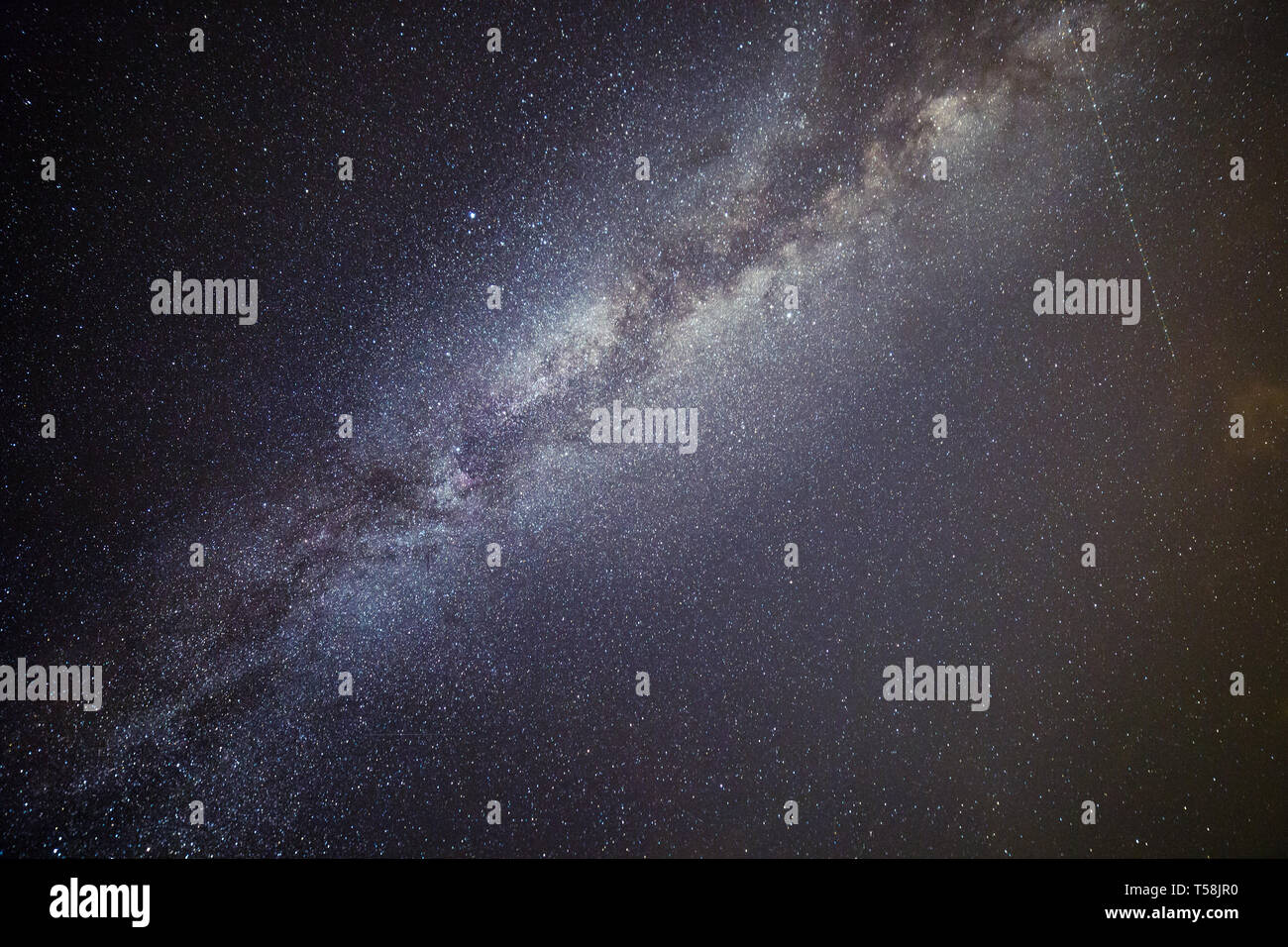 Plane Trail Crossing the Milky Way and Starry Sky Stock Photo - Alamy