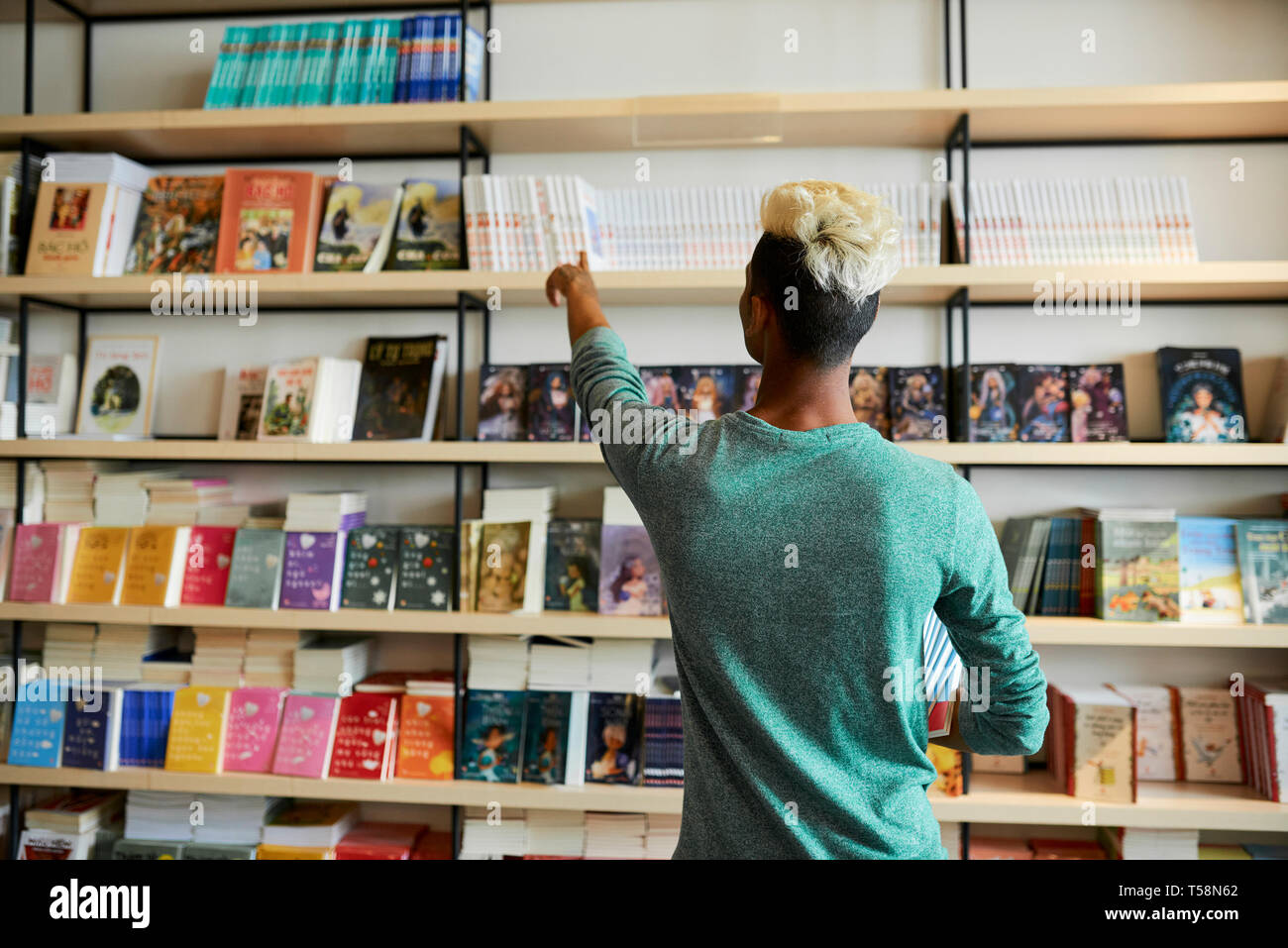 Employee in bookstore hi-res stock photography and images - Alamy