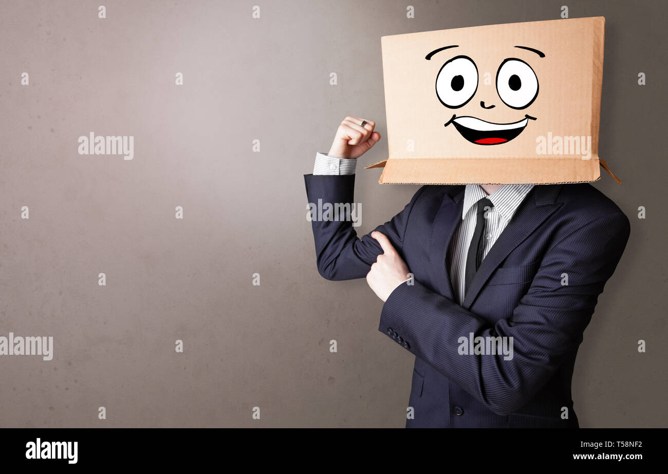 Young boy standing and gesturing with a cardboard box on his head Stock ...