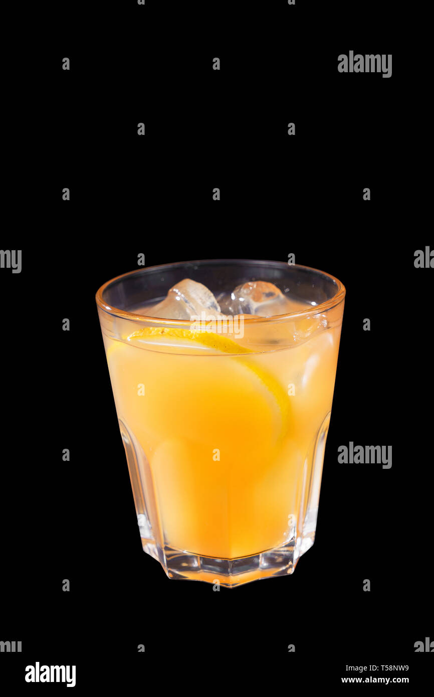 A yellow opaque cocktail in a low glass with ice cubes, with the taste ...