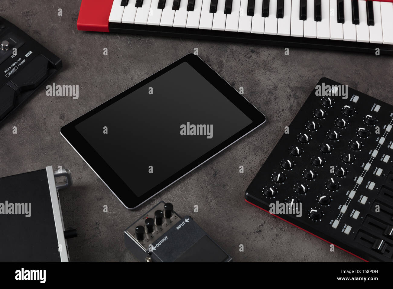 Empty tablet and electronic music instruments Stock Photo - Alamy