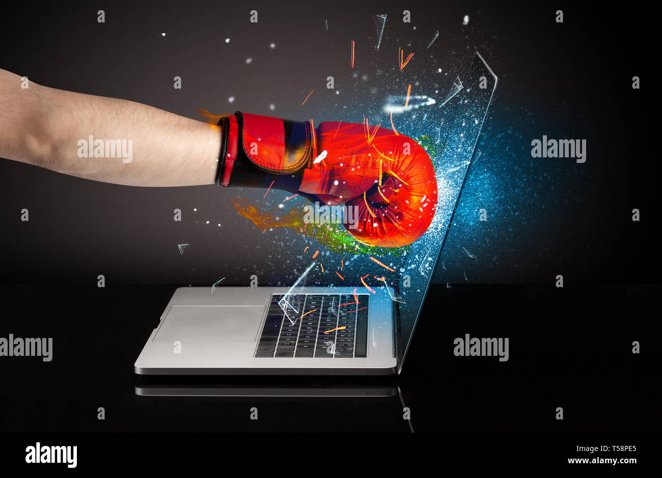 Firing hand hitting strongly laptop screen glass Stock Photo - Alamy