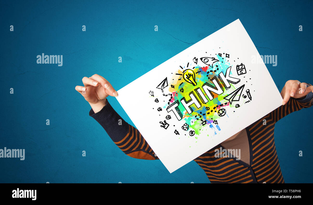 Young person holding paper with design thinking concept Stock Photo - Alamy