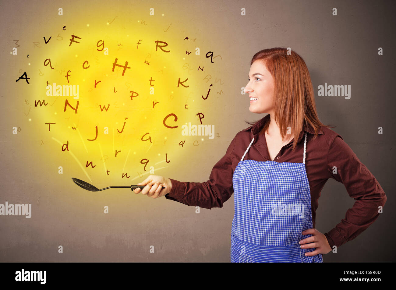 Young person cooking letters in wok Stock Photo - Alamy