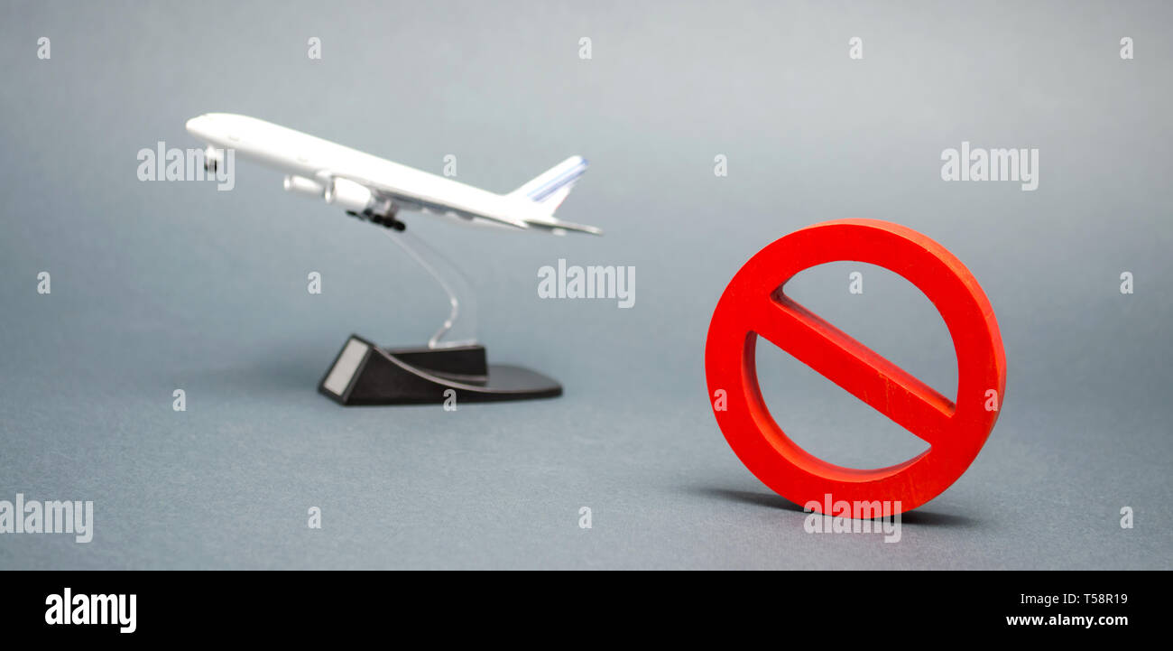 The sign of the ban and a miniature toy aircraft. Ban on flights of ...