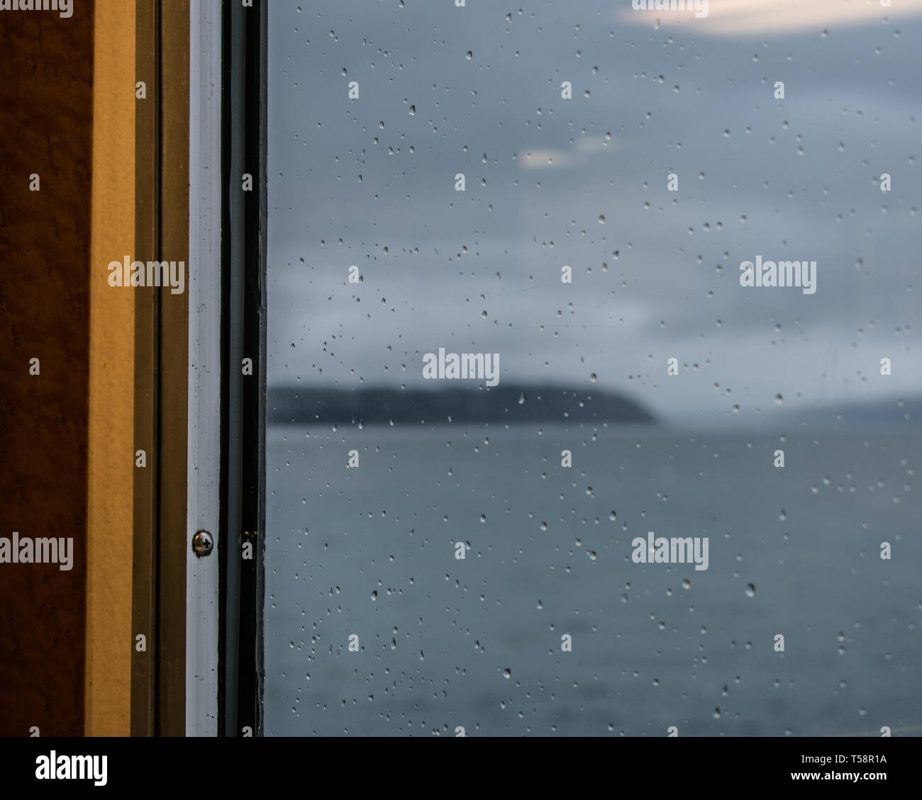 Ocean view through rainy window of ferry boat ride Stock Photo - Alamy