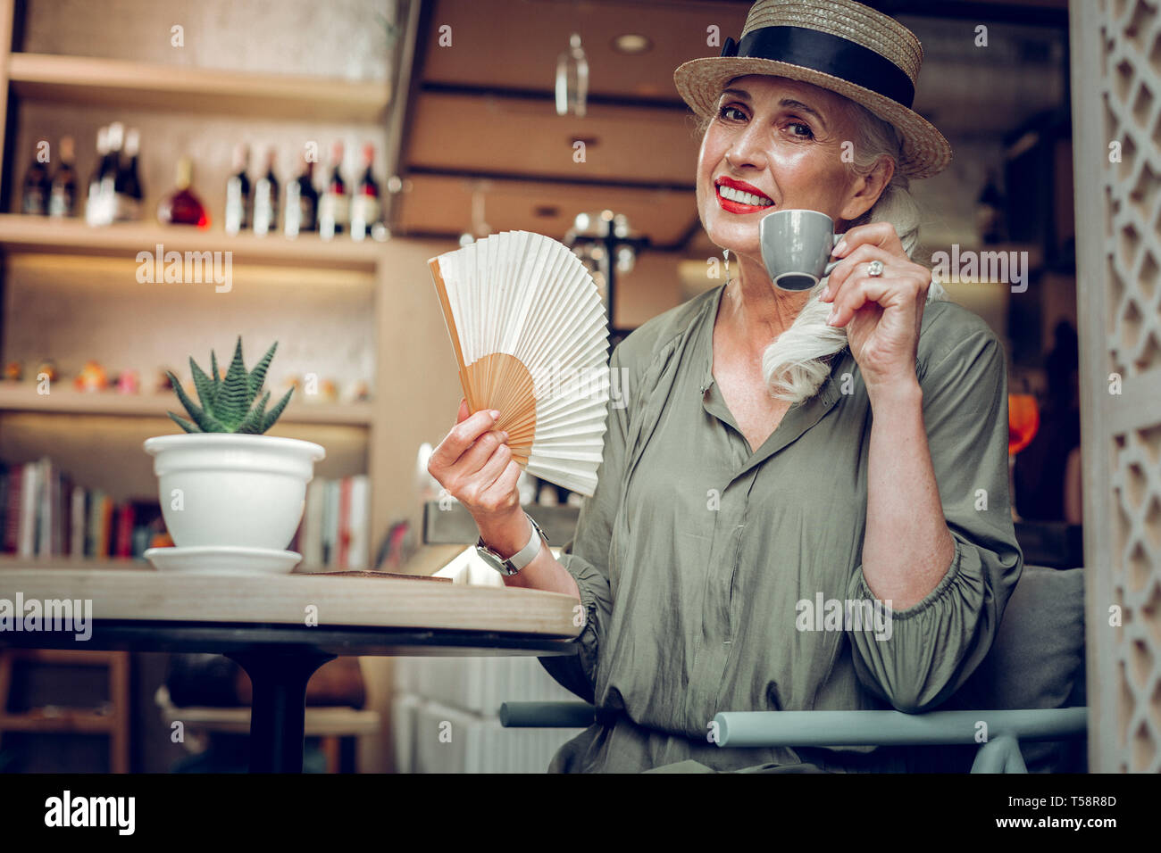 Woman alone hand fan hi-res stock photography and images - Alamy