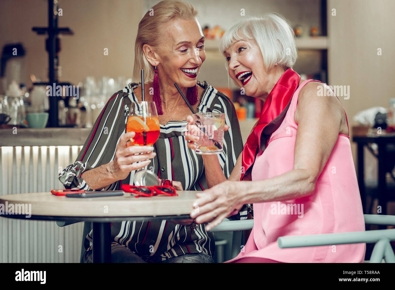Happy positive women having lots of fun Stock Photo - Alamy