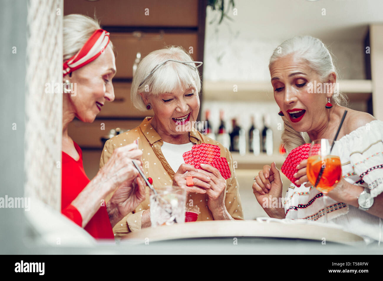 Women looking at cards hi-res stock photography and images - Alamy