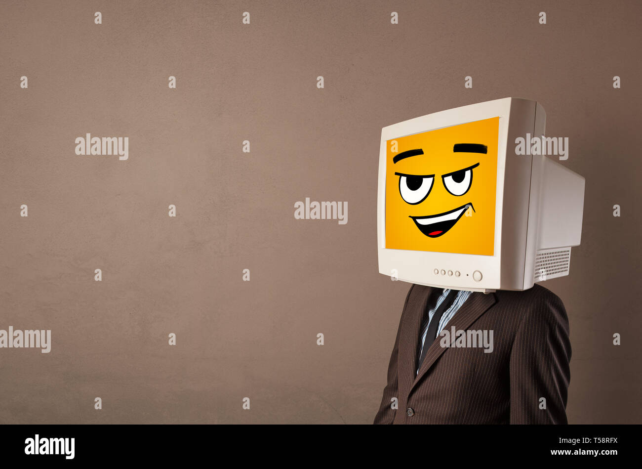 Young person with happy smiley monitor head Stock Photo - Alamy