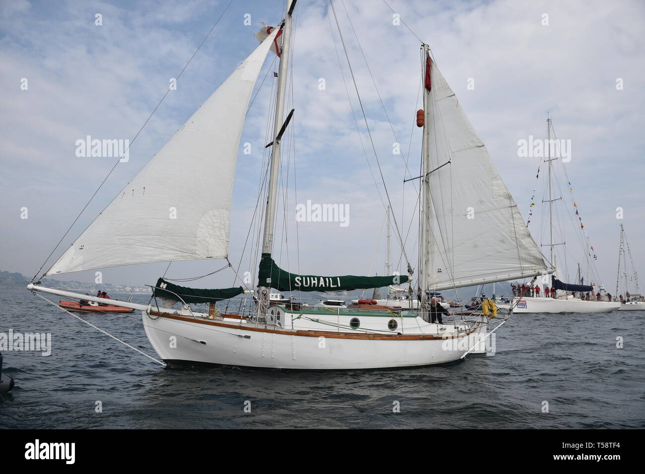 Sir Robin Knox-Johnson on board Suhali, is escorted by a flotilla of ...