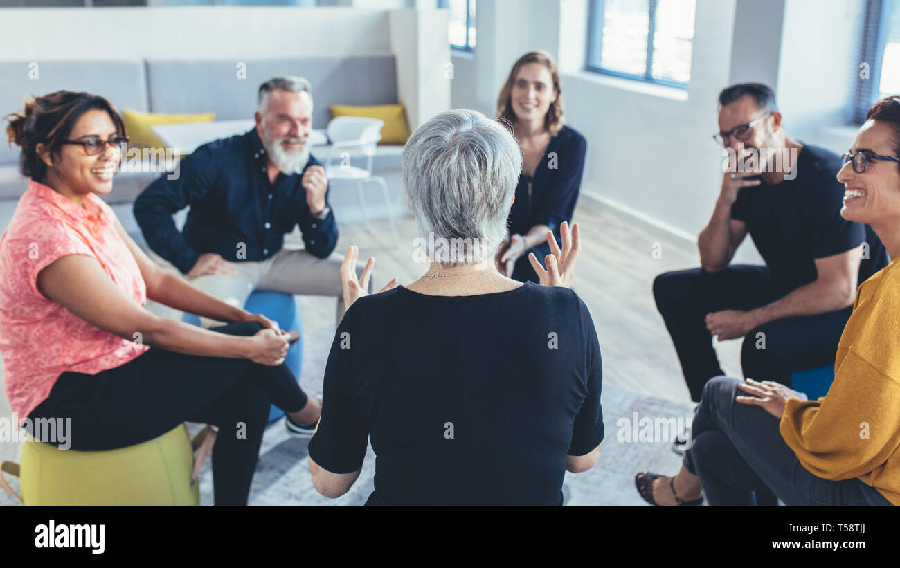 Coworkers talking in a circle hi-res stock photography and images - Alamy