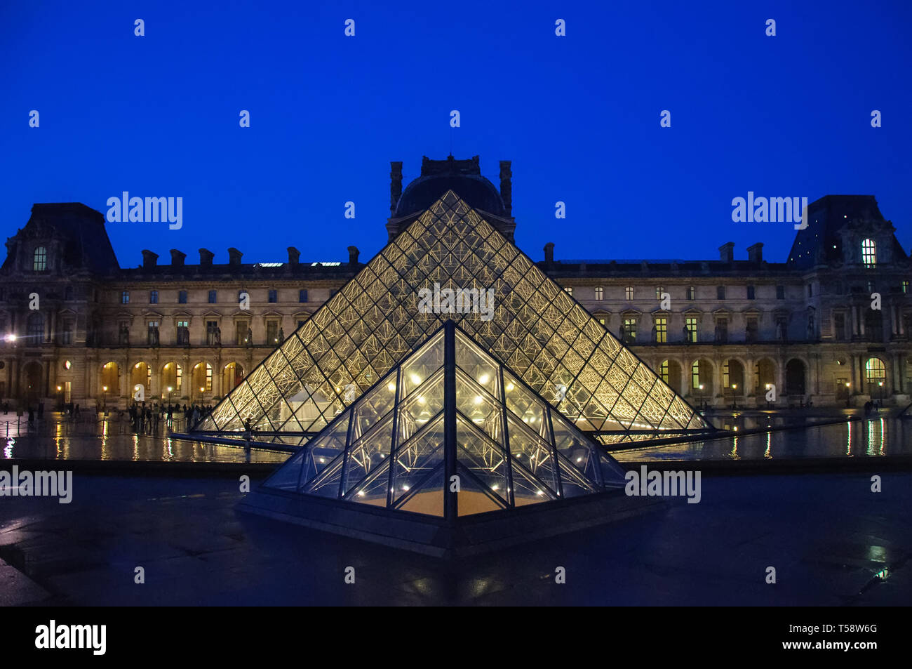 Louvre museum at twilight in winter. Louvre museum is one of the world ...