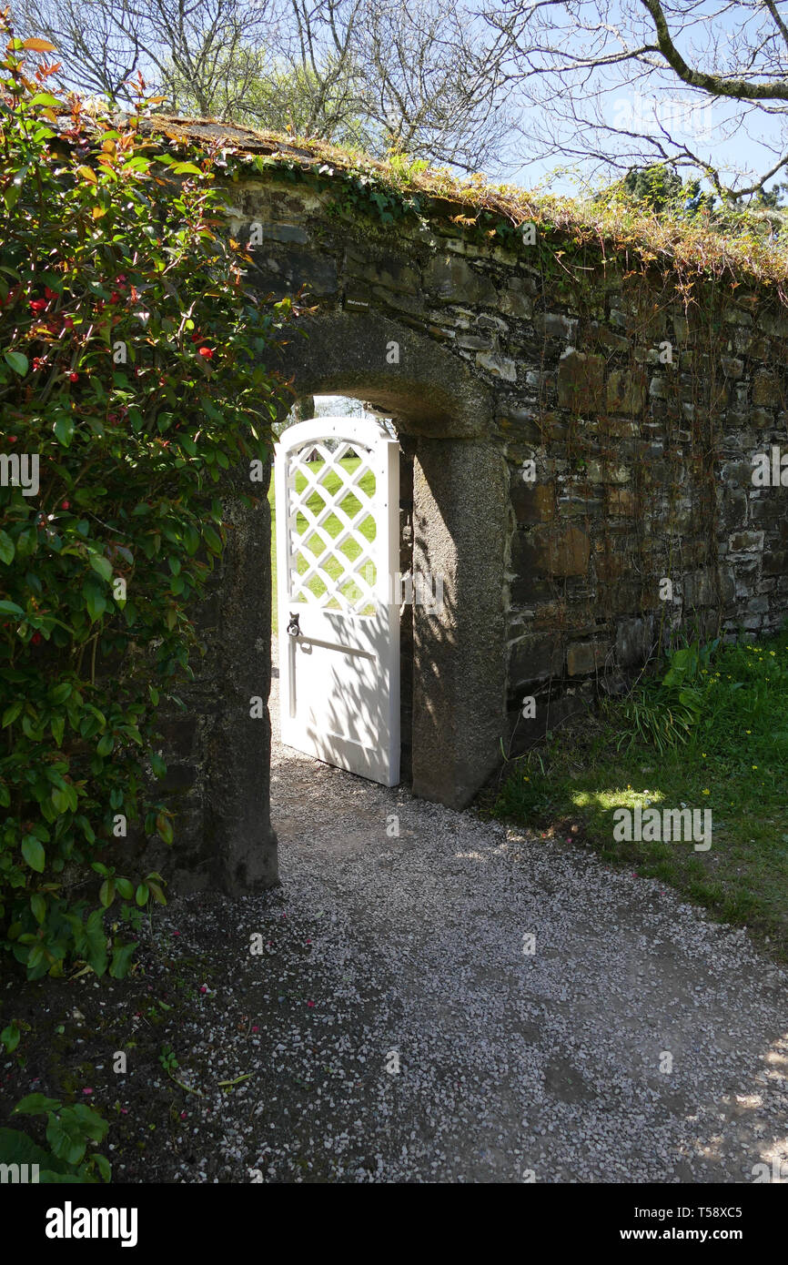 Path and gate to walled garden Stock Photo - Alamy