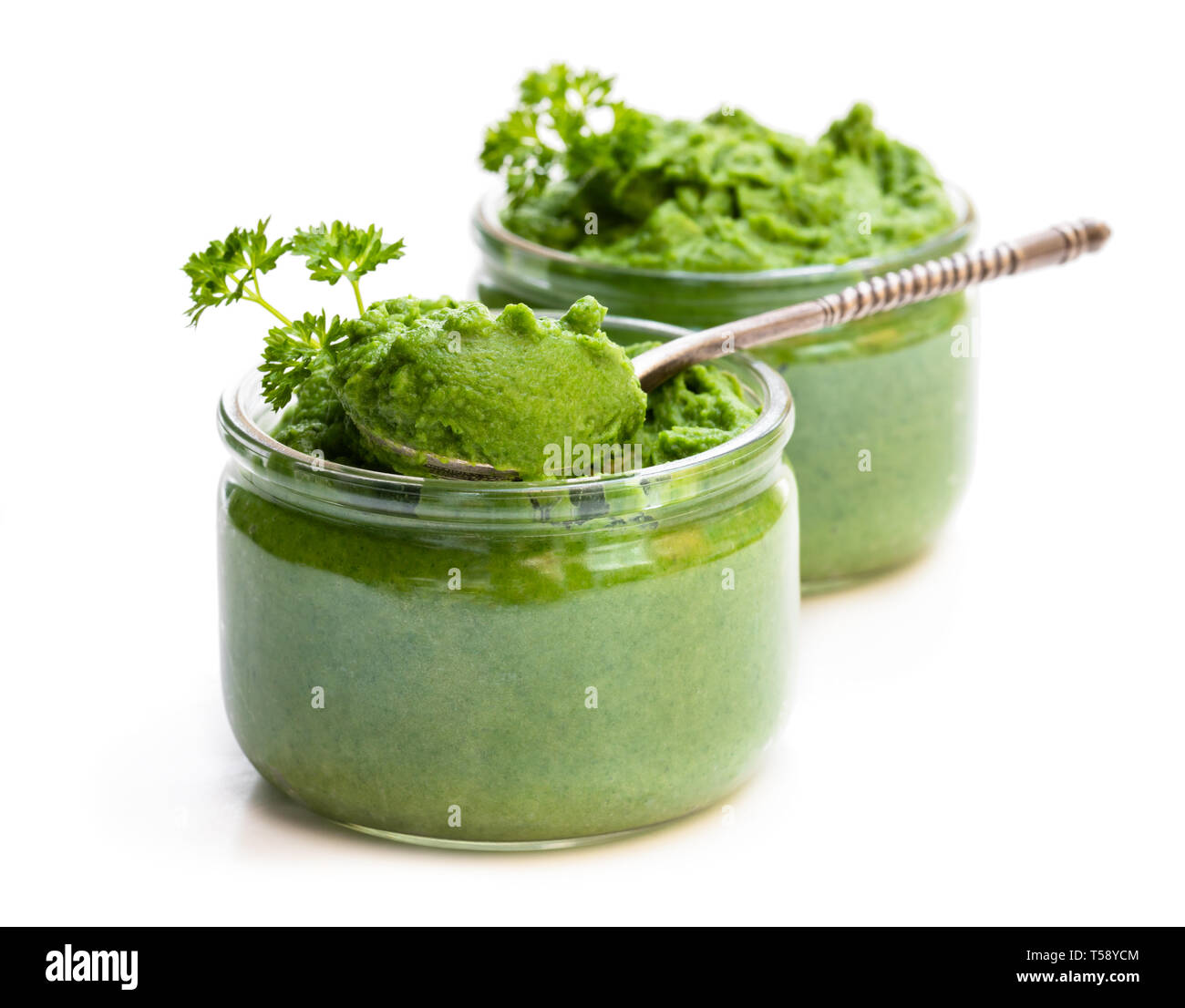 Green puree in glass jars isolated on white Stock Photo - Alamy