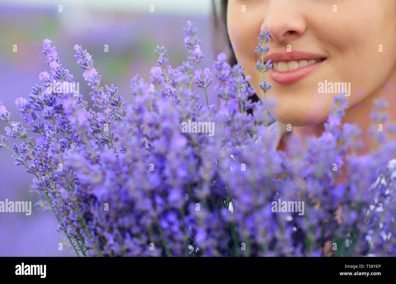 beautiful woman face with lavender flower Stock Photo - Alamy
