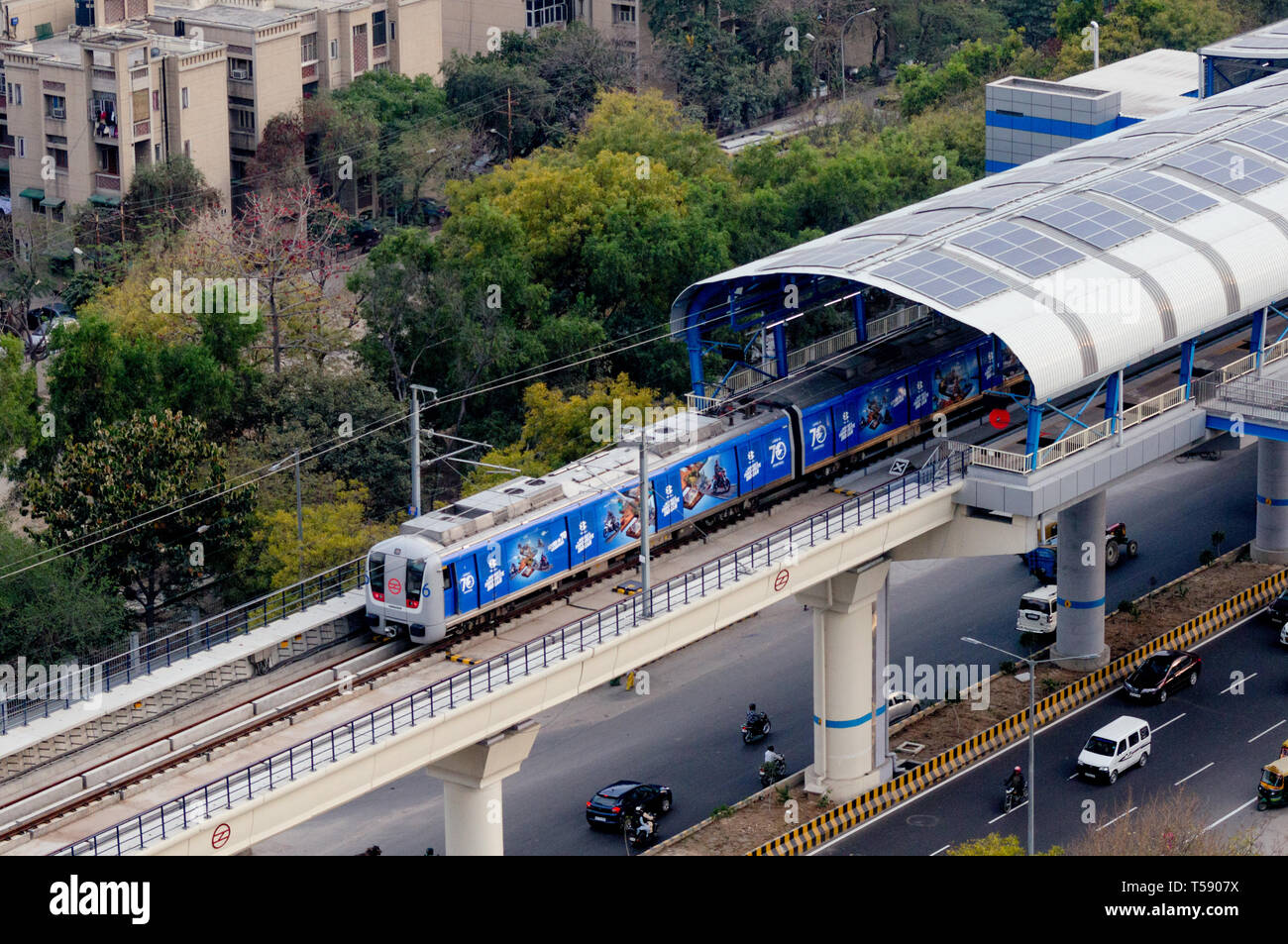 Aerial shot of metro train arriving at an elevated metro station Stock ...