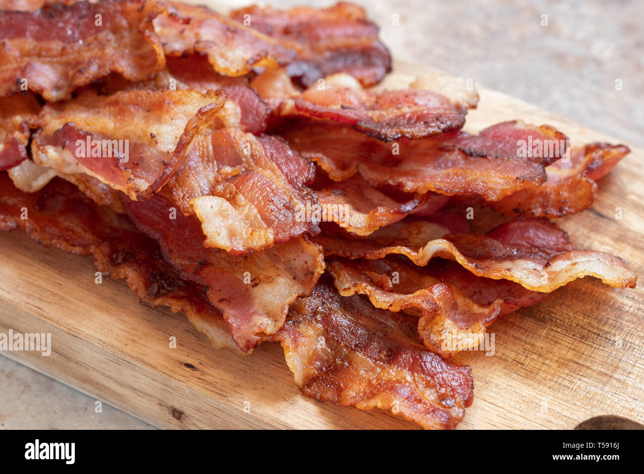 Cooked Greasy Bacon Stock Photo - Alamy