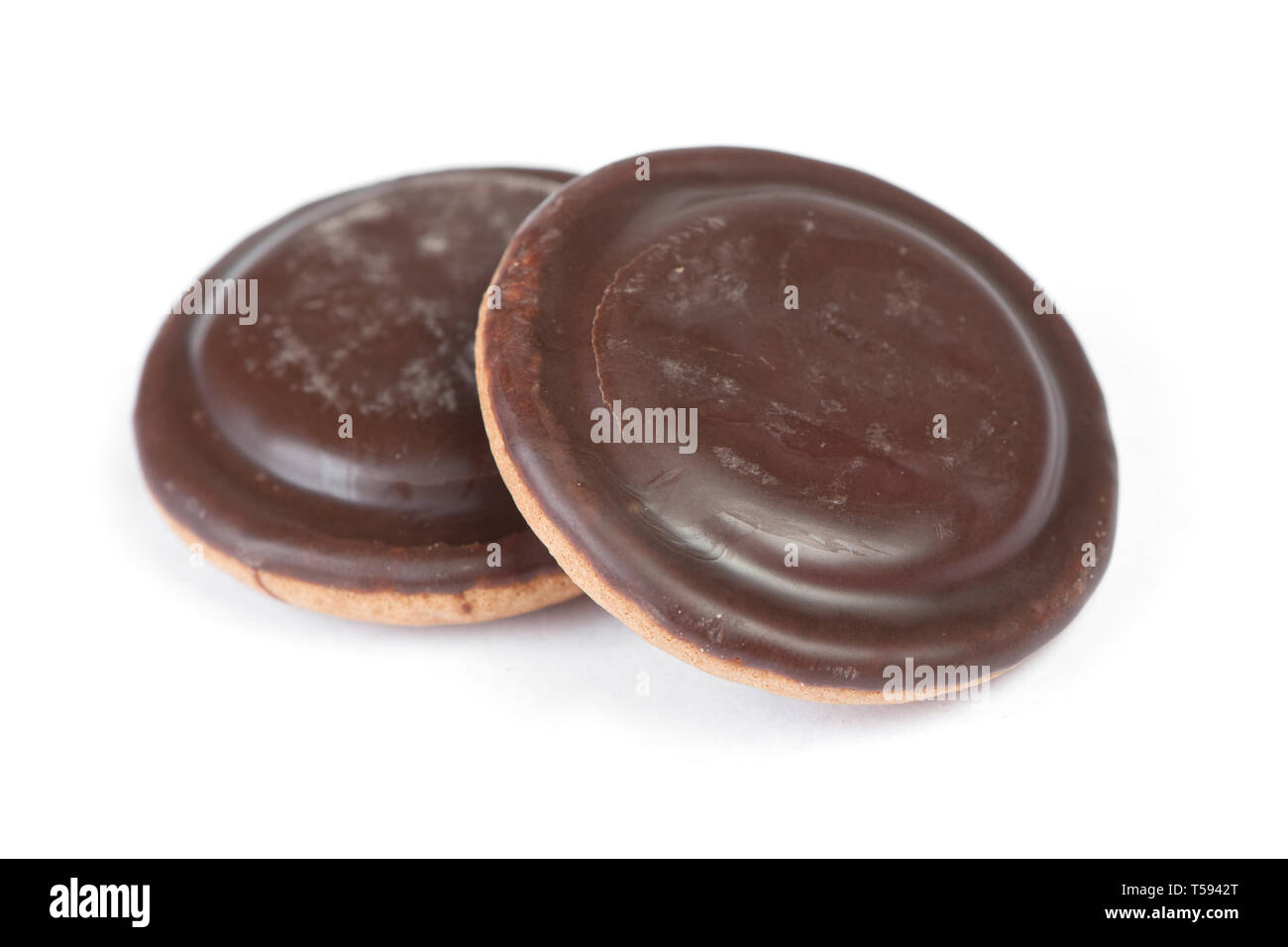Group of round delicious glazed chocolate chip cookies with jam inside ...