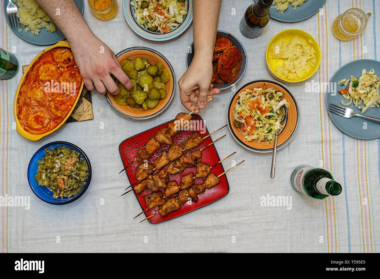 Toasts and beats with glasses at a festive family feast. Flat lay ...