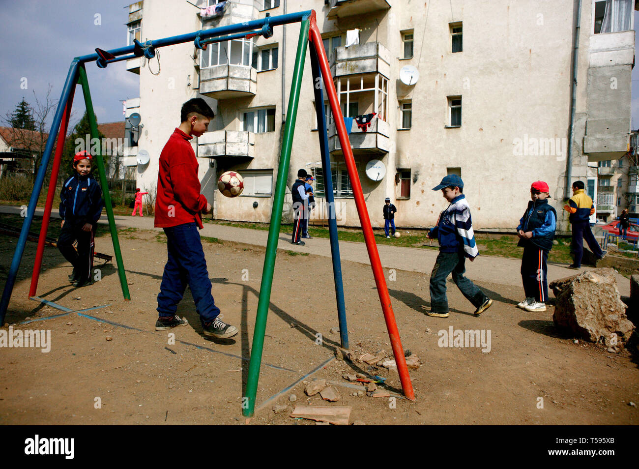 Children playing football on the streets of Jibou, Romania. 17/03/2007 ...