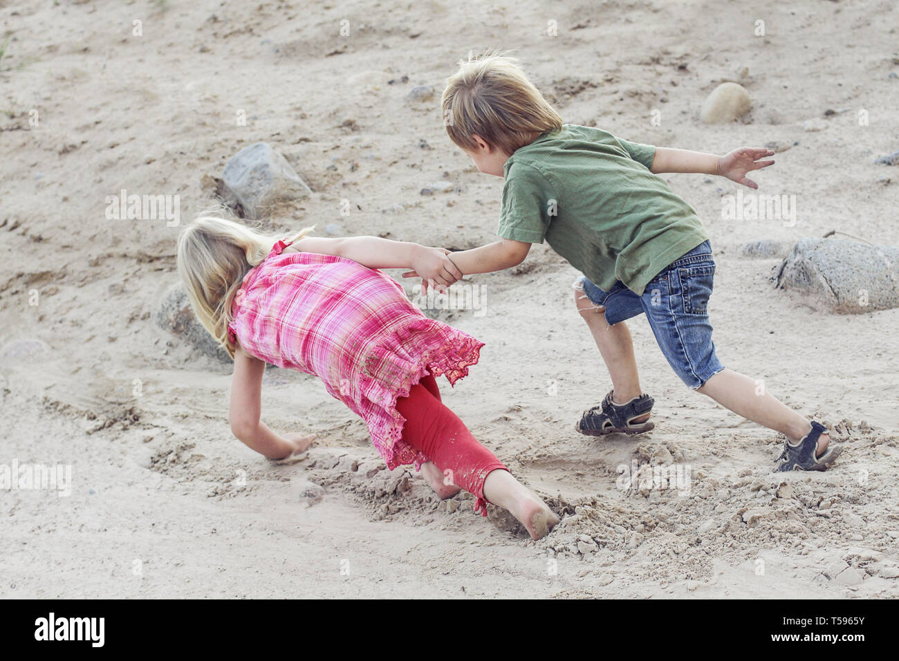 Children help each other. Help concept outdoor Stock Photo - Alamy