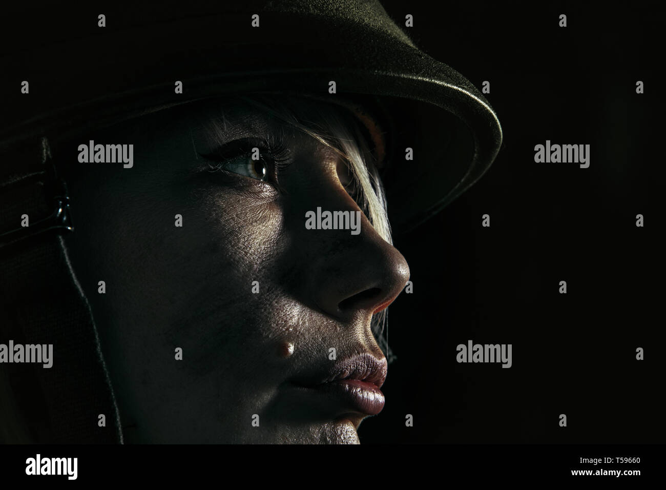 The pain is getting physical. Close up portrait of young female soldier ...
