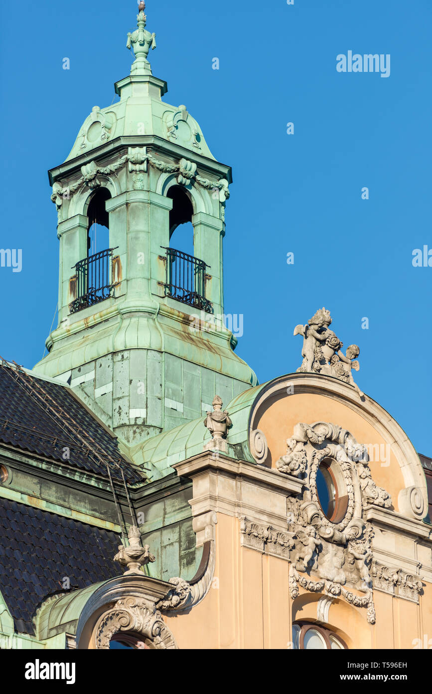 The ornate tower decorating the top of one of the largest buildings on ...