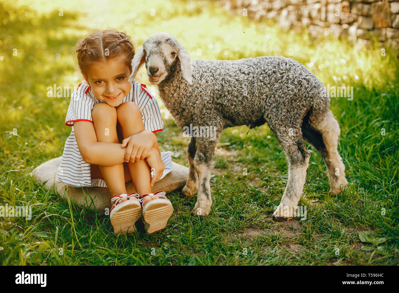 beautiful girl with goat Stock Photo - Alamy