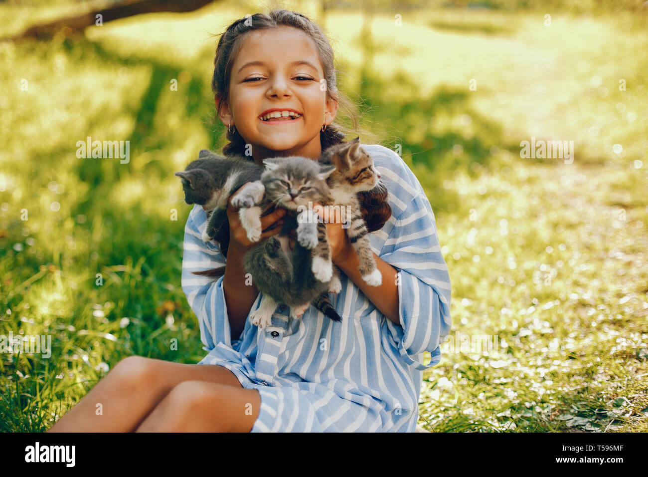 beautiful girl with cats Stock Photo - Alamy