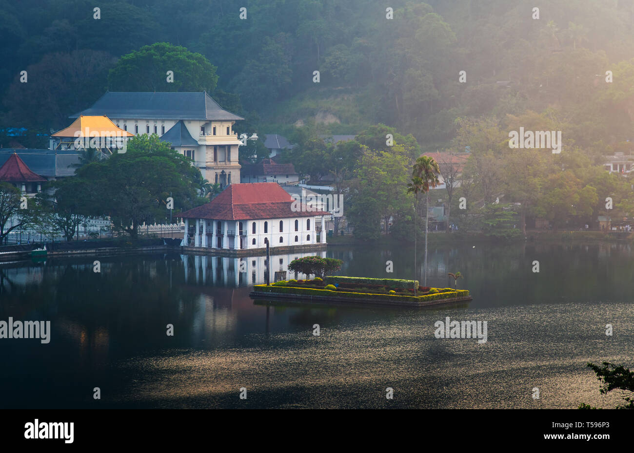 Sunrise over Kandy lake and landmark temple in Sri Lanka Stock Photo ...