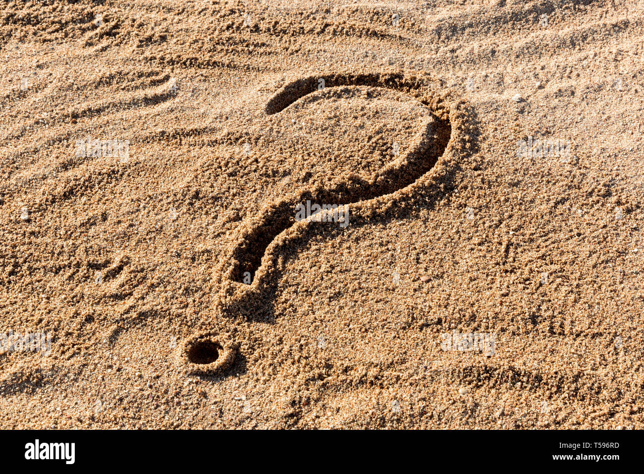 question marks written on beach sand close up, with copy space Stock ...