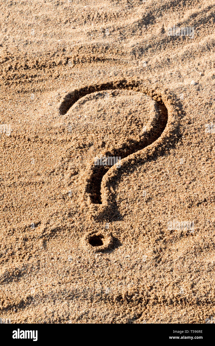 question marks written on beach sand close up, with copy space Stock ...