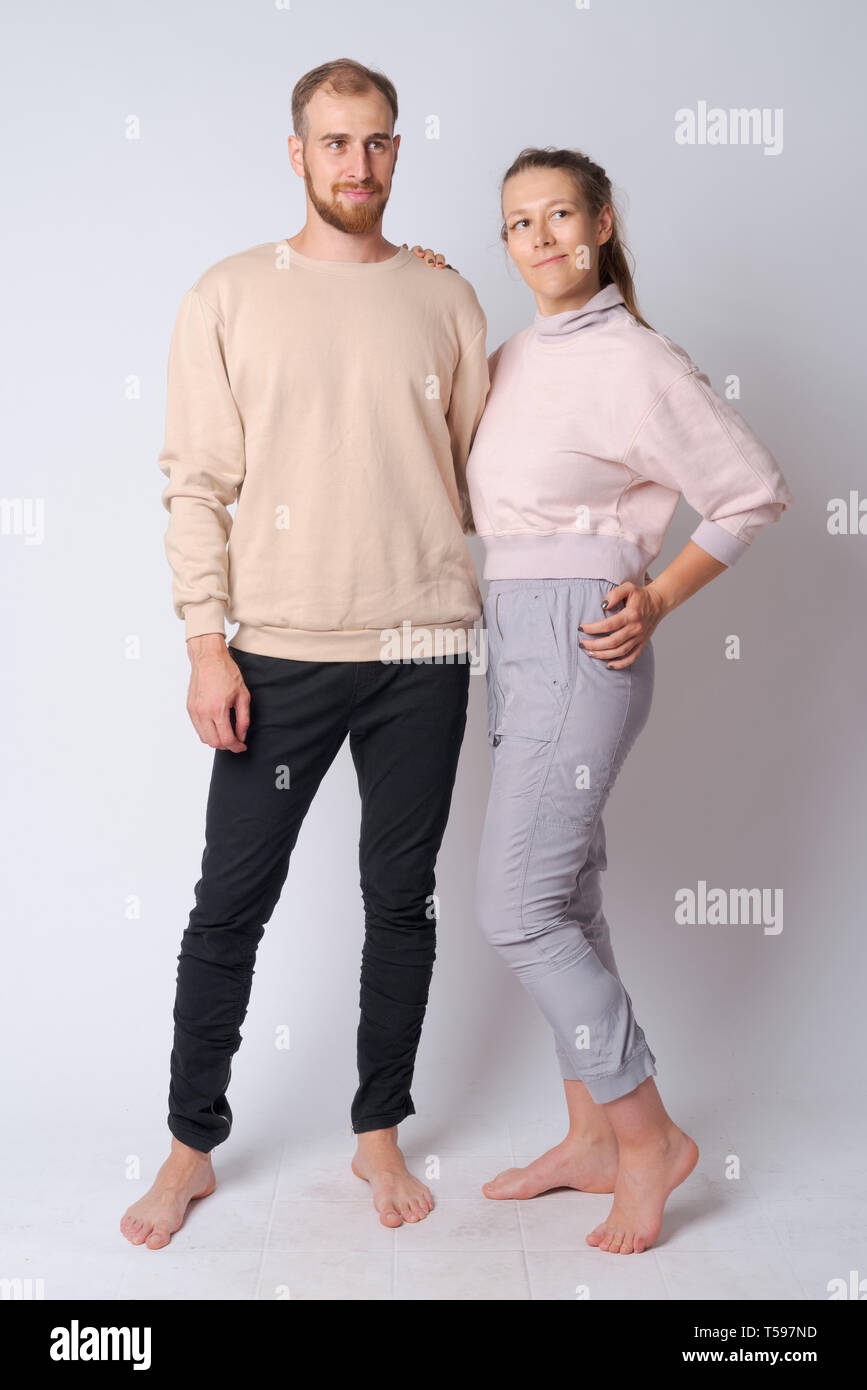 Full body shot of young couple thinking together Stock Photo - Alamy