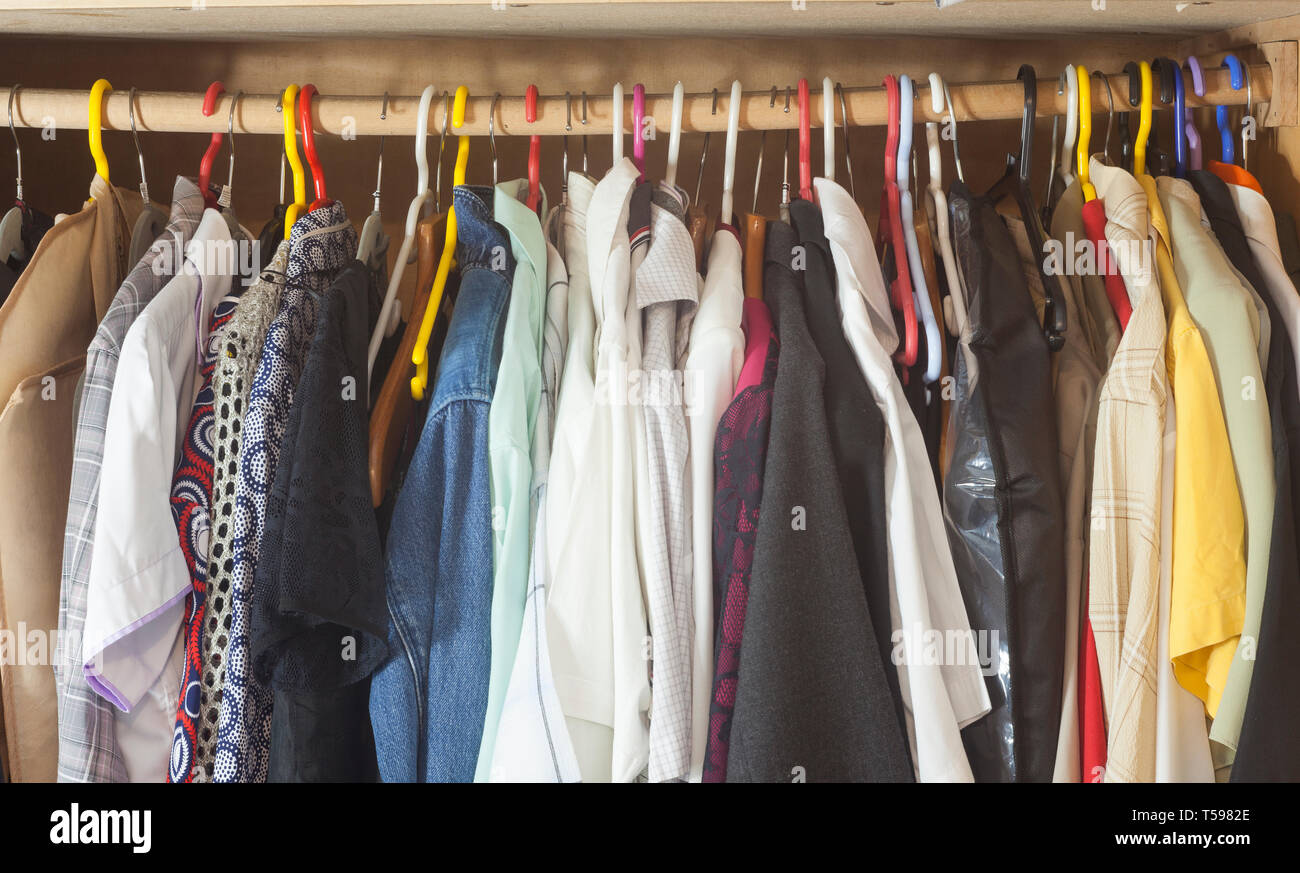 many clothes in closet. fashion concept Stock Photo - Alamy