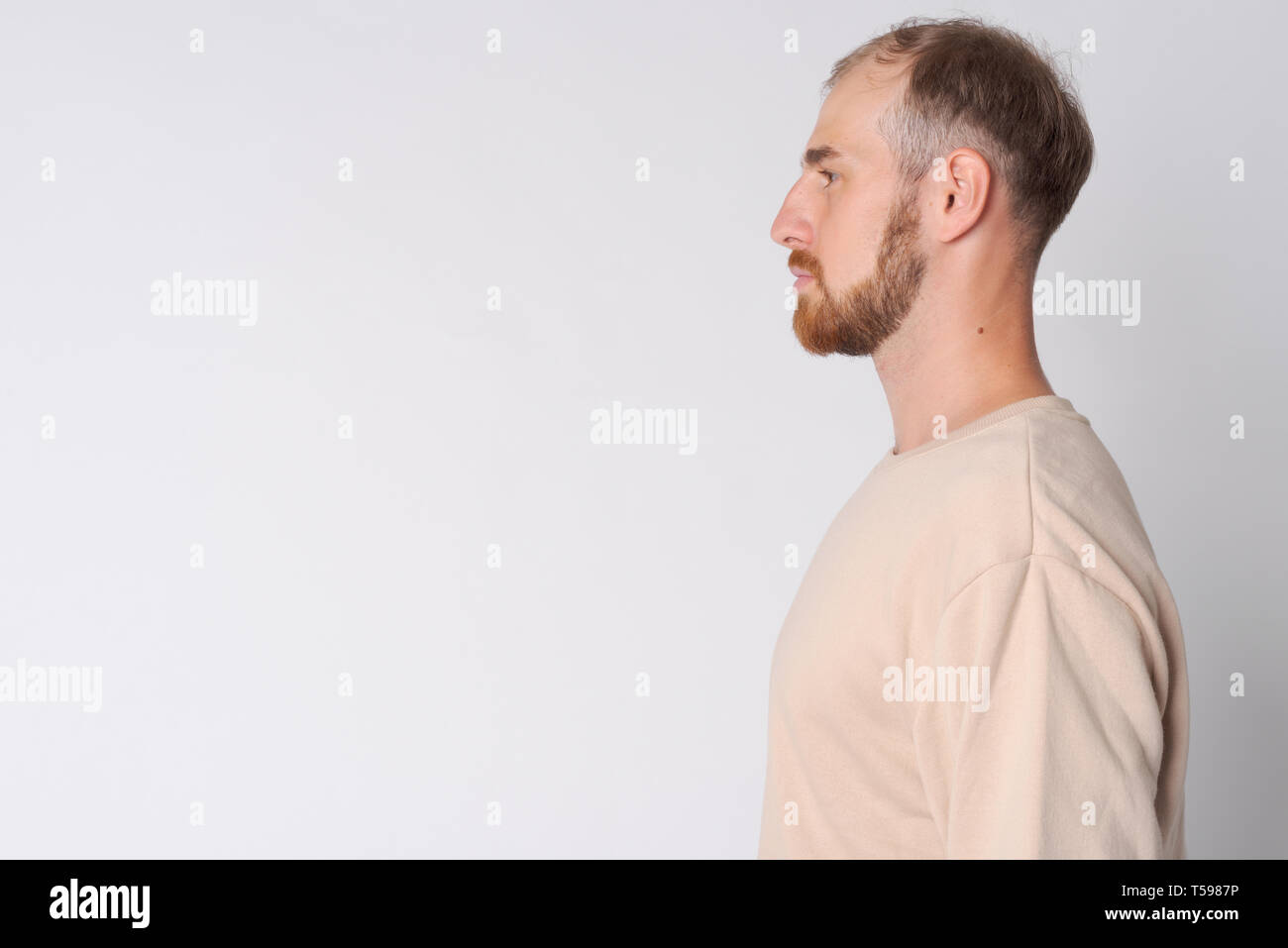 Closeup profile view of young bearded man Stock Photo - Alamy