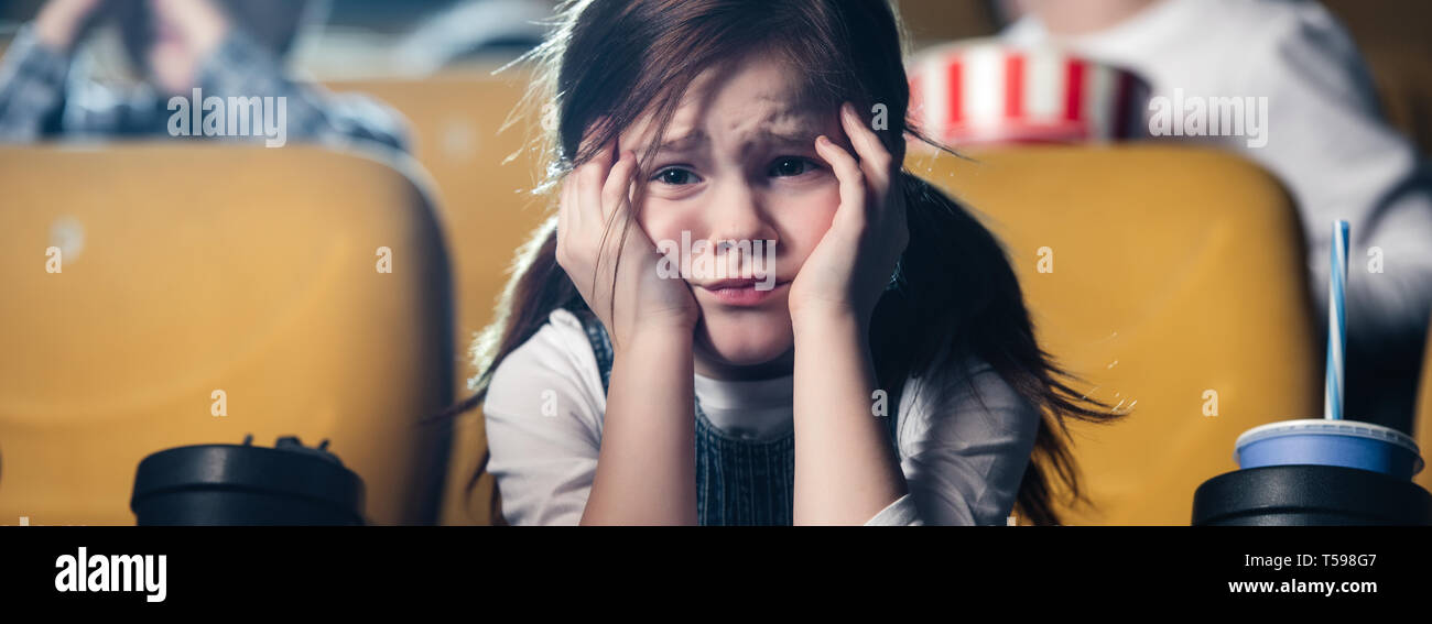 panoramic shot of upset child watching movie in cinema Stock Photo - Alamy