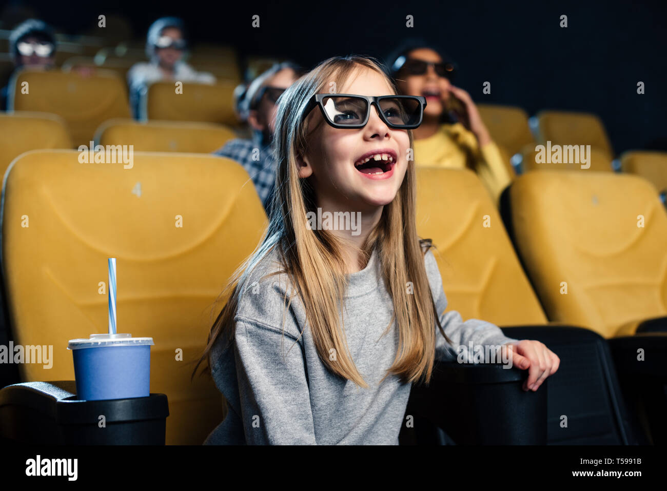 happy excited child in 3d glasses watching movie in cinema Stock Photo ...