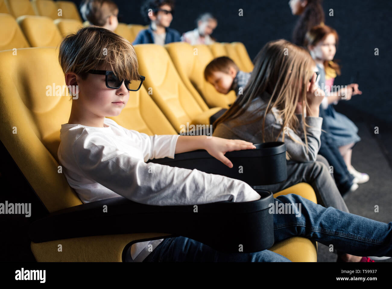 Boys in cinema hall hi-res stock photography and images - Alamy