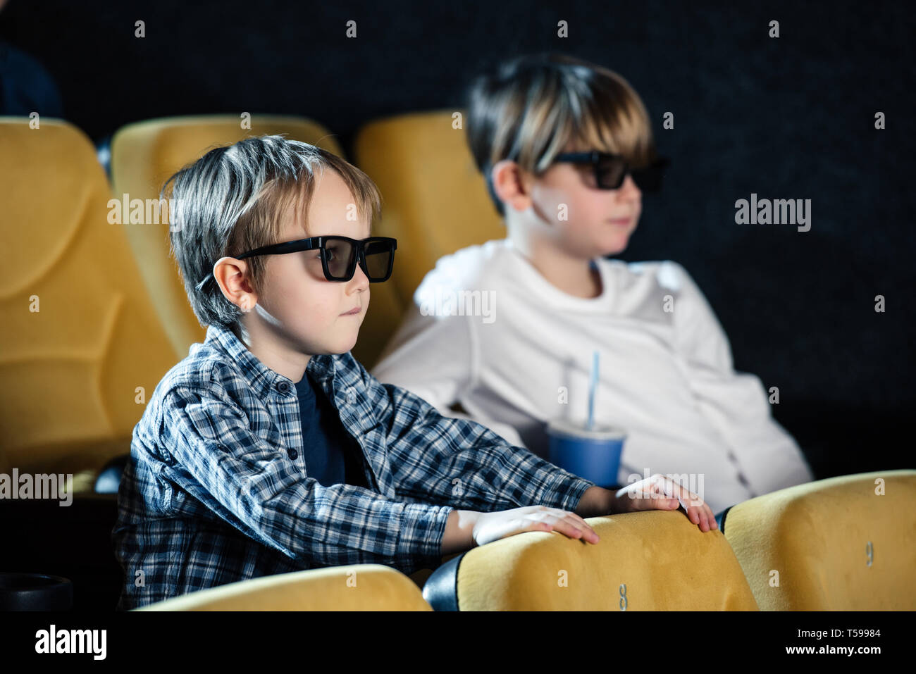 Boys in cinema hi-res stock photography and images - Alamy