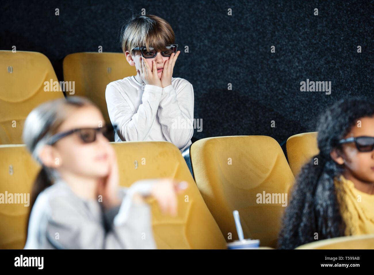 Boy with hands on face hi-res stock photography and images - Alamy