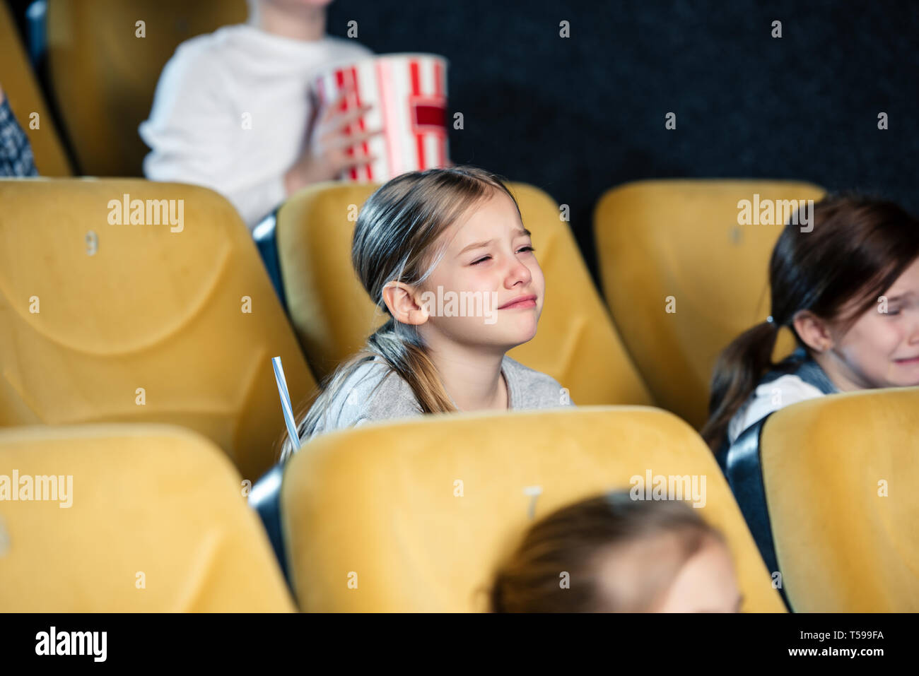 upset worried children watching movie in cinema together Stock Photo ...