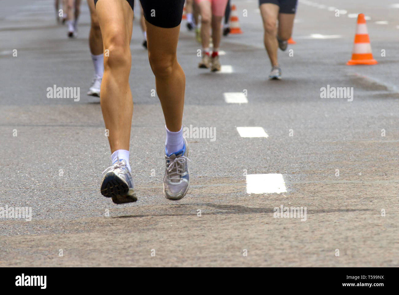 Female runner legs outdoors, leading in marathon Stock Photo - Alamy