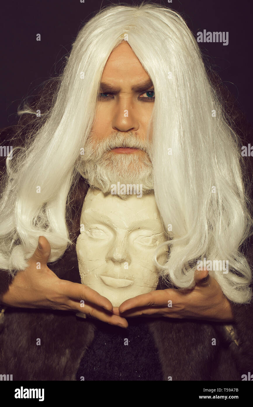 bearded man with sculpture head Stock Photo - Alamy