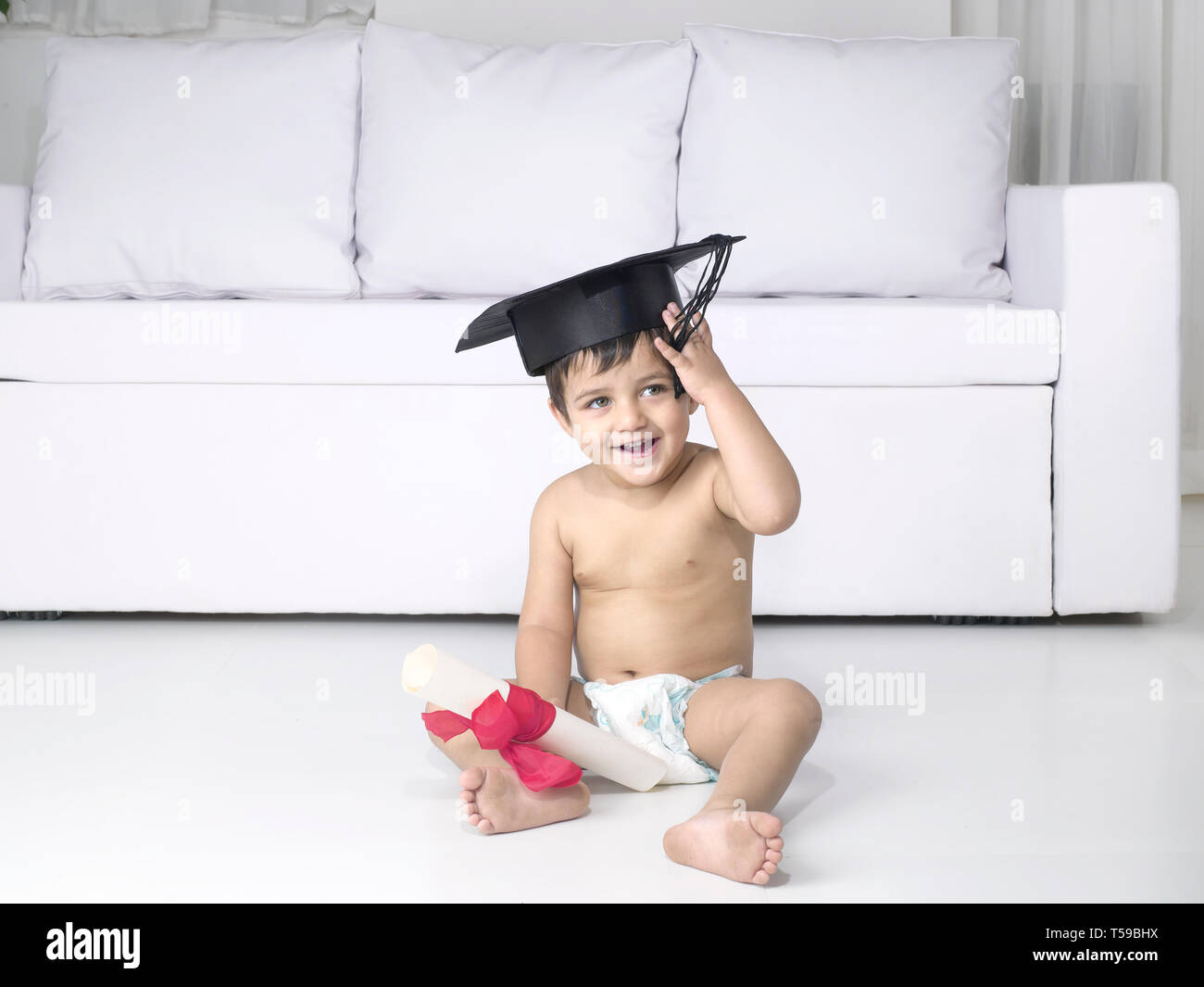 Baby holding degree certificate hi-res stock photography and images - Alamy