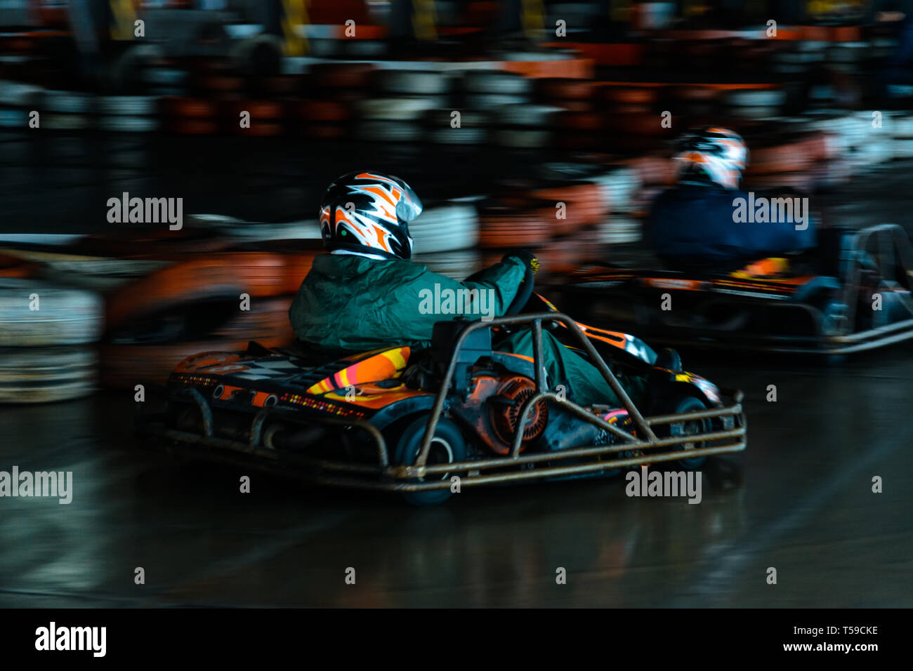 Dynamic karting competition at speed with blurry motion on an equipped ...
