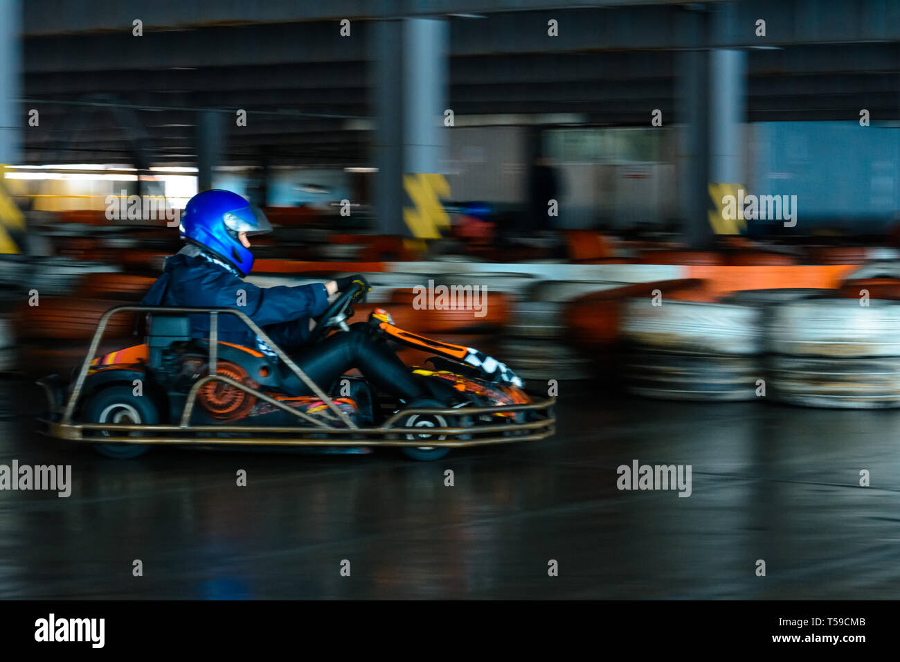 Dynamic karting competition at speed with blurry motion on an equipped ...