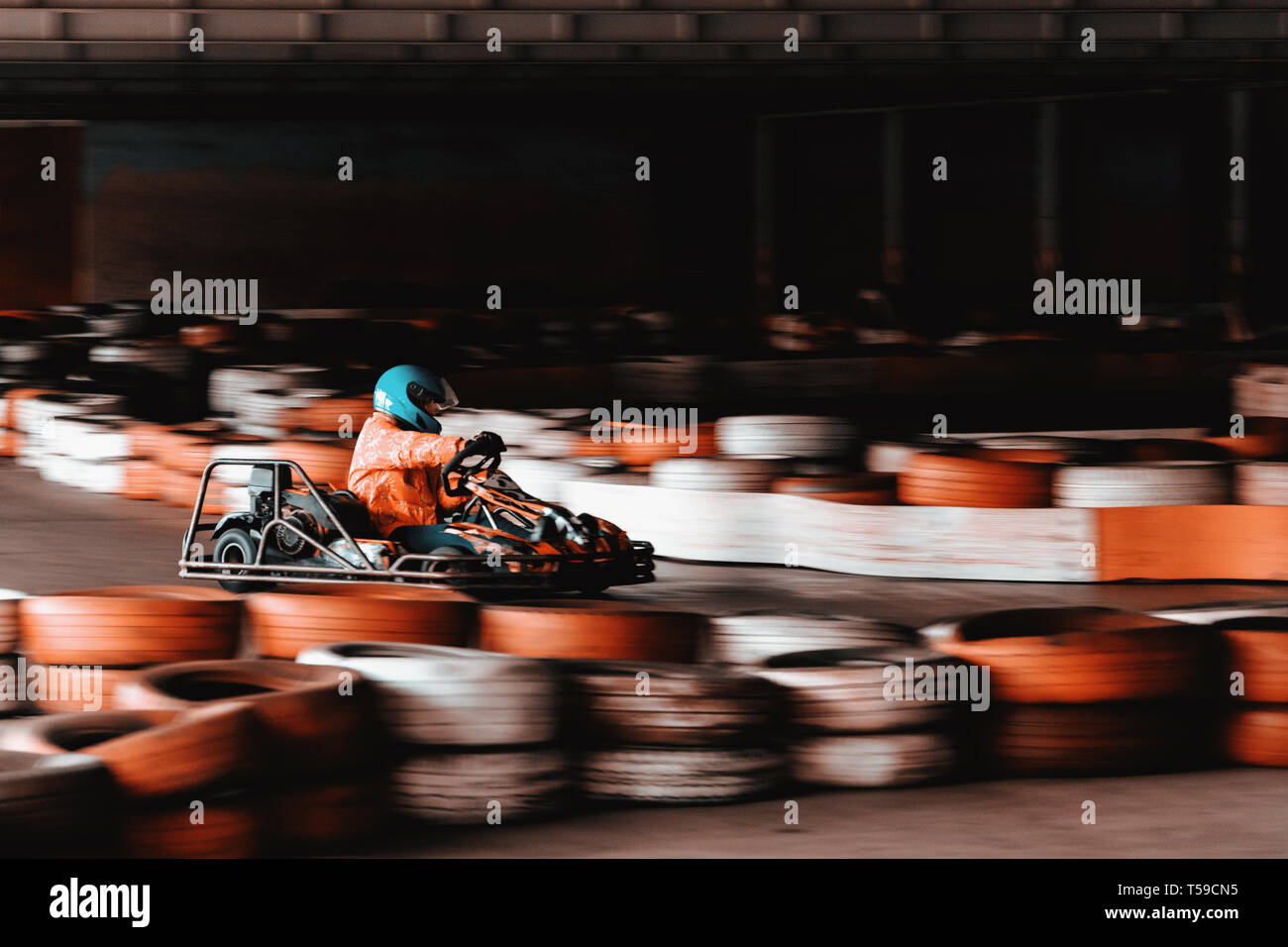 Dynamic karting competition at speed with blurry motion on an equipped ...