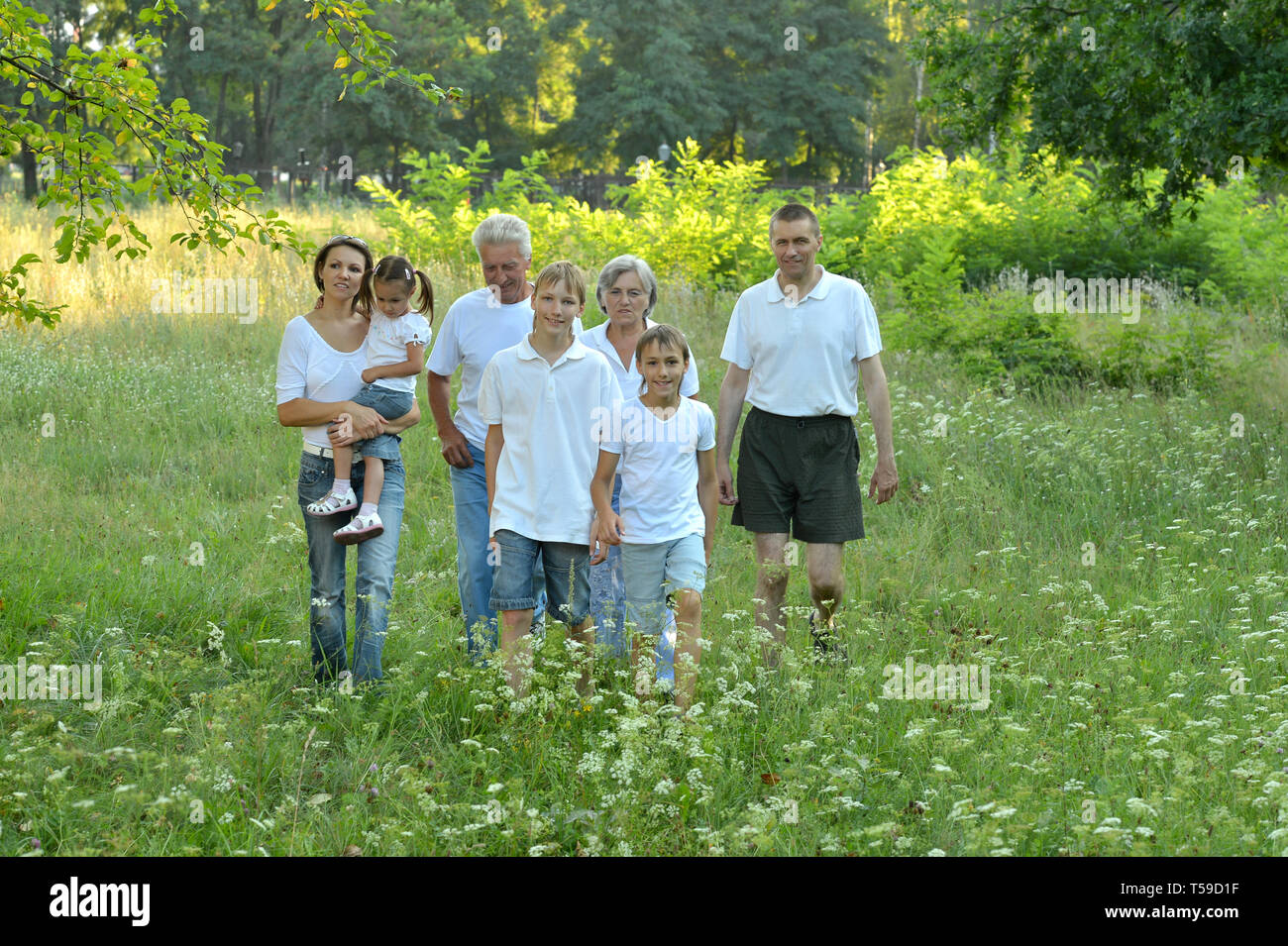 Mother having fun with her children in nature hi-res stock photography ...